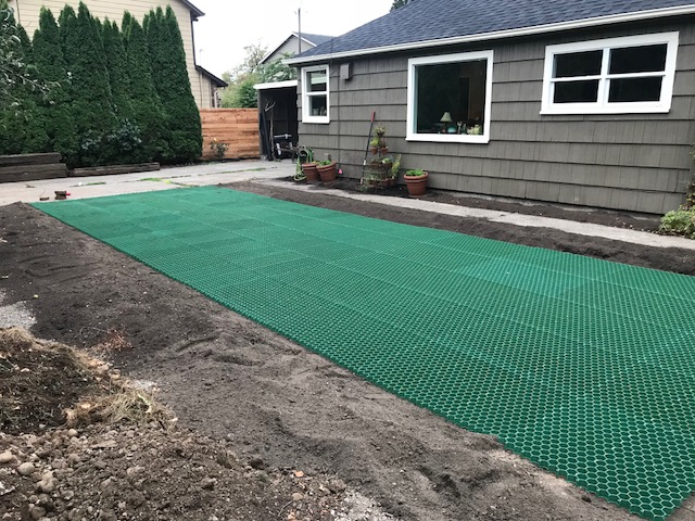 Grass surfaces stabilized for pedestrian traffic and vehicle parking